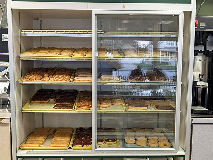Behold, the holy grail of pastries! This display case is like Fort Knox for carb enthusiasts, guarding a treasure trove of golden, flaky delights.