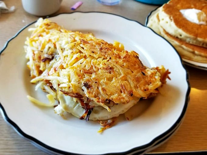 Behold, the Mona Lisa of breakfast plates! This hashbrown omelet is a crispy, cheesy masterpiece that Leonardo da Vinci would've painted... and then devoured.