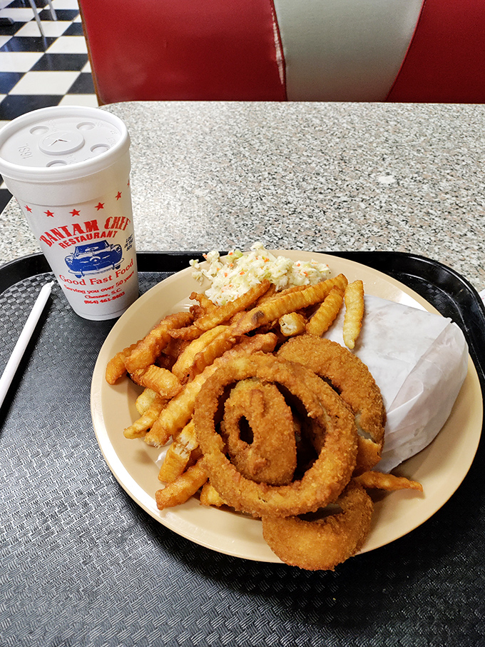 The holy trinity of diner delights: A burger that means business, fries crispy enough to make a potato proud, and a milkshake that's basically dessert in disguise.