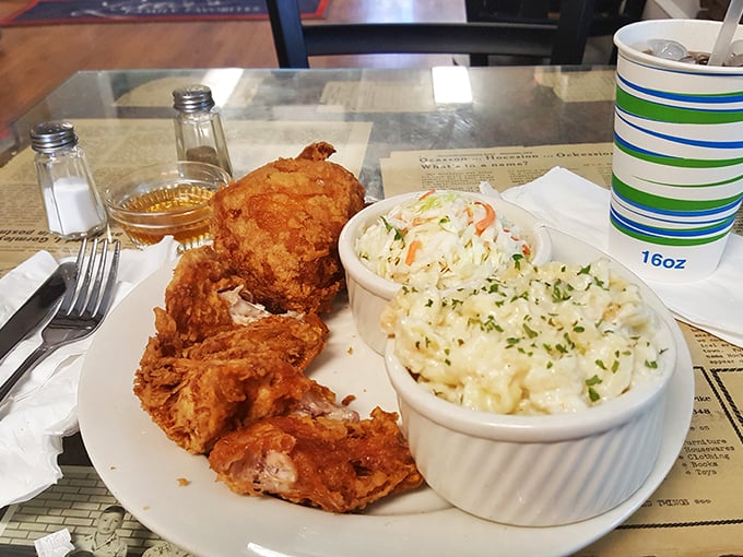 A plate that screams "cheat day"! Golden-fried chicken nestled next to creamy mac and cheese &ndash; it's like a hug for your taste buds.