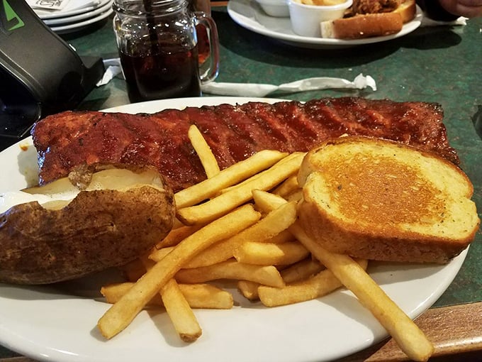 Is it just me, or did this plate just whisper "challenge accepted"? A full rack of ribs that's more tempting than hitting the snooze button on a Monday morning.