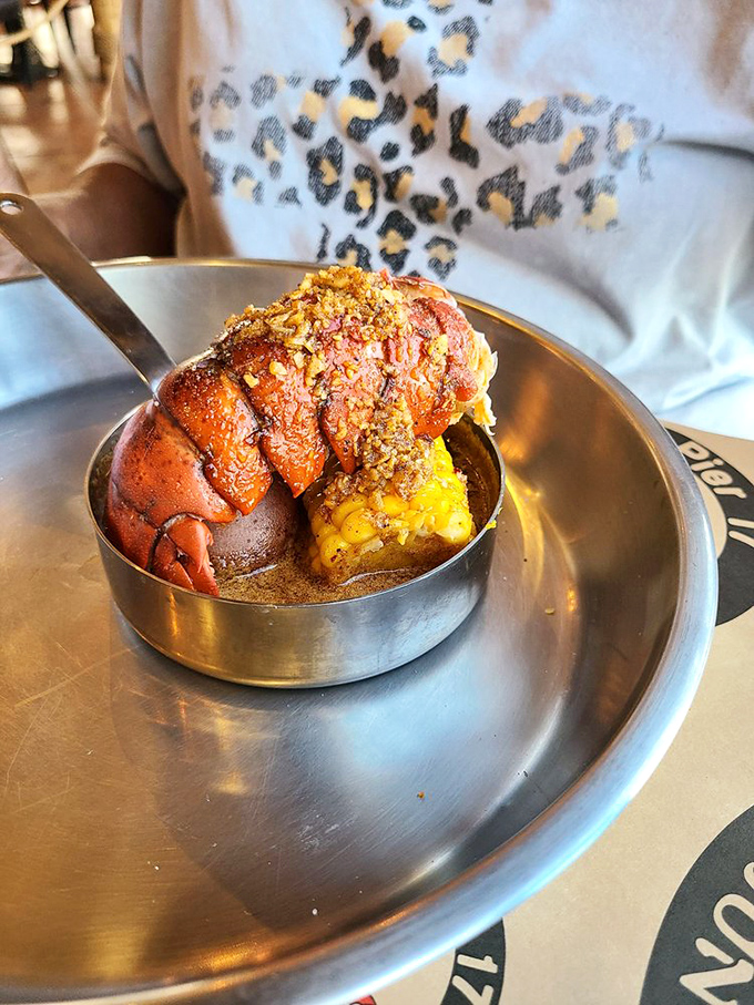 This isn't just a lobster tail; it's a crustacean masterpiece. Butter-drenched and perfectly grilled, it's the Mona Lisa of the seafood world.