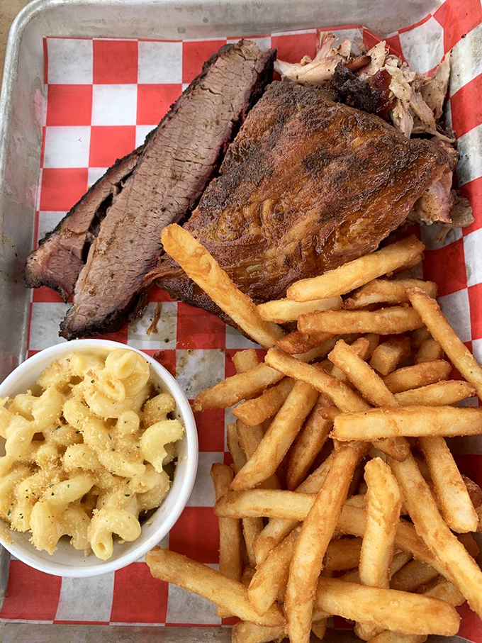 Brisket so tender it practically surrenders at the sight of your fork, accompanied by mac and cheese that outshines even the main attraction.