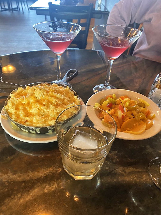 Pink cocktails and yellow mac and cheese – it's like a sunset you can eat, with pickled vegetables providing a perfect acidic counterpoint.