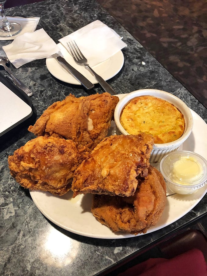 Southern comfort meets Midwestern charm! This plate of crispy fried chicken alongside creamy soup is a match made in heaven.