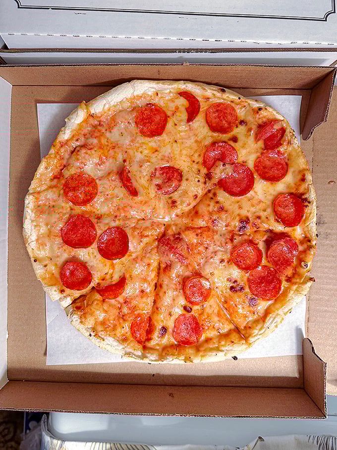 Pizza perfection to-go! This pepperoni pie is so photogenic, it could be the next Instagram food influencer.