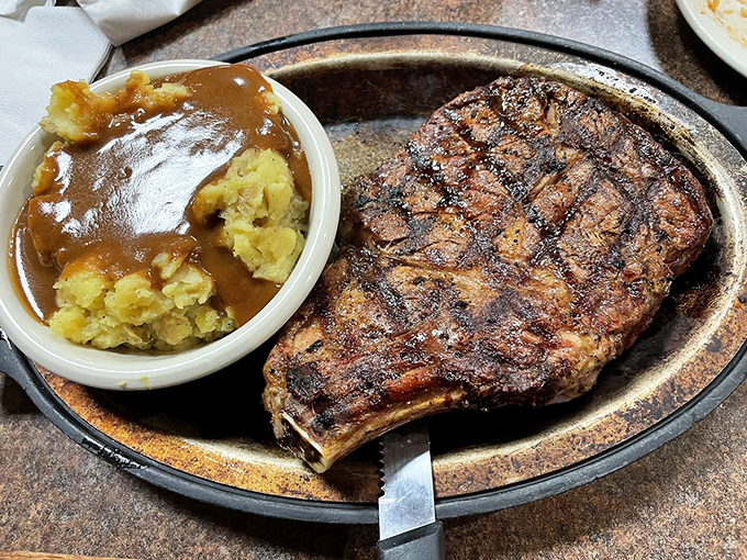 Behold the ribeye, a steak so magnificent it could make a vegetarian weep. Paired with those golden potatoes, it's a plate of pure joy.