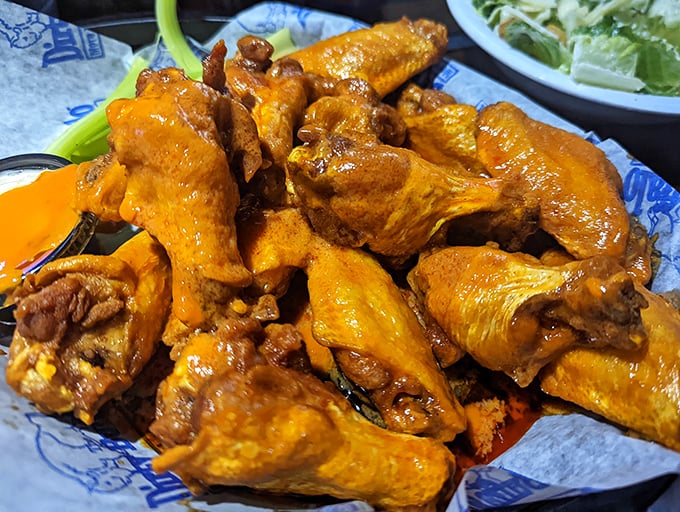 Orange-hued masterpieces that make you question why you ever bothered eating anything else. These wings don't just have heat&mdash;they have personality.