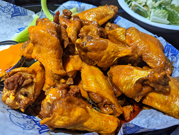 Orange-hued masterpieces that make you question why you ever bothered eating anything else. These wings don't just have heat&mdash;they have personality.