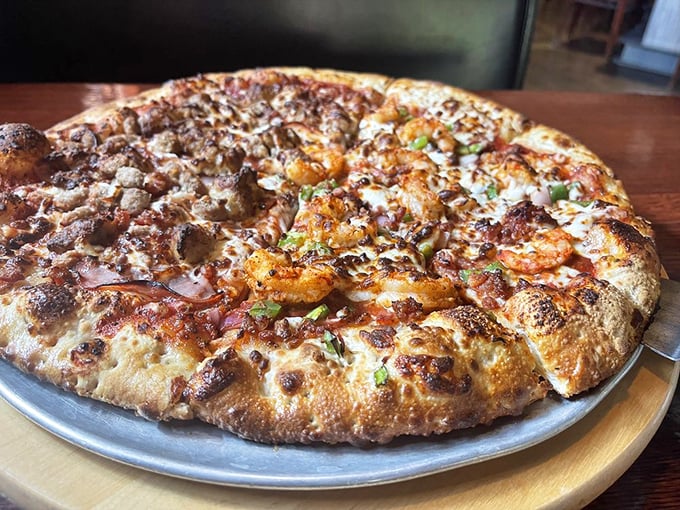 A tale of two pizzas: The Acadiana and Colossal Meat. It's like the Sharks and Jets of the pizza world, but everyone's a winner here.