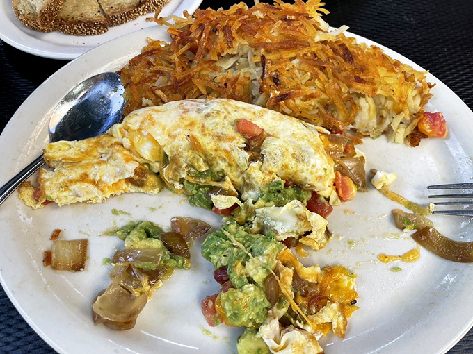 Garden of eatin'! This veggie omelet is packed with so much goodness, it's like a farmer's market wrapped in a warm, eggy hug.