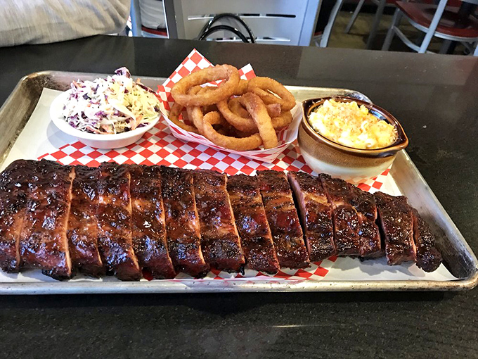 The holy trinity of BBQ! Ribs, onion rings, and mac 'n' cheese &ndash; a combo that'll make you want to kiss the chef.