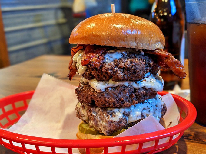 The Leaning Tower of Beef-sa! This triple-decker masterpiece is what happens when a burger goes to the gym and gets swole.