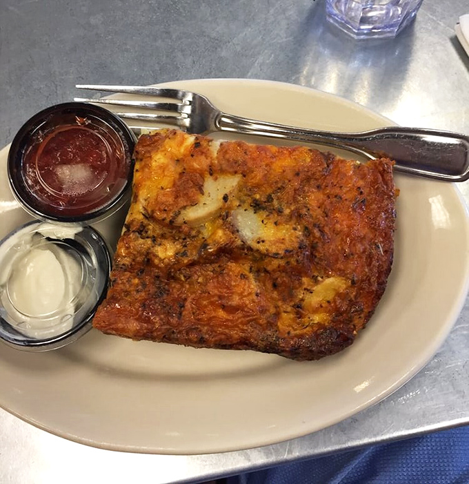 Behold, the holy trinity of breakfast: bacon, cheese, and potatoes. It's like a hug for your stomach, but with more calories.