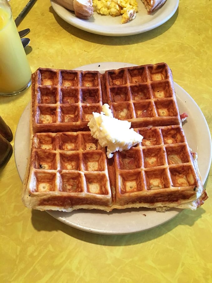Waffle perfection! Golden, crispy, and ready for its syrupy close-up. Bacon's just along for the tasty ride.