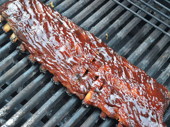 Behold, the holy grail of barbecue! These saucy ribs are so tender, they practically fall off the bone with a gentle breeze.