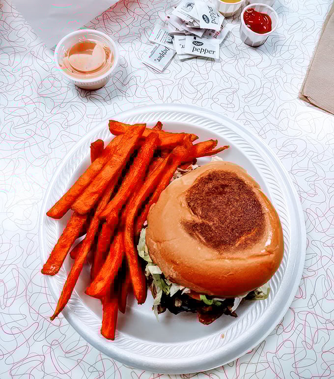 Burger bliss! This Bay Ken Burger looks so good, it might just make vegetables jealous. Fries on the side? More like supporting actors in a meaty blockbuster.