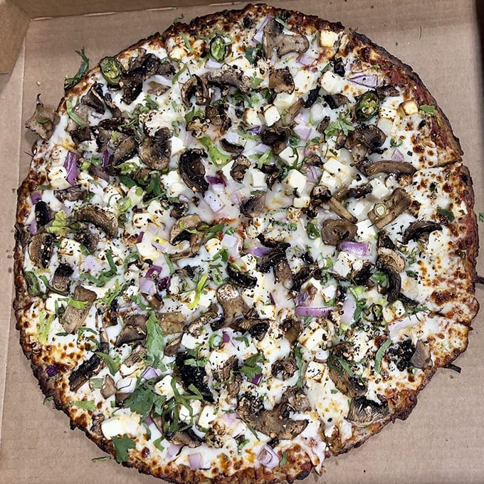 Cauliflower crust? Check. Veggie toppings? Double check. This pie is so virtuous, it practically comes with a halo... and a flavor explosion!
