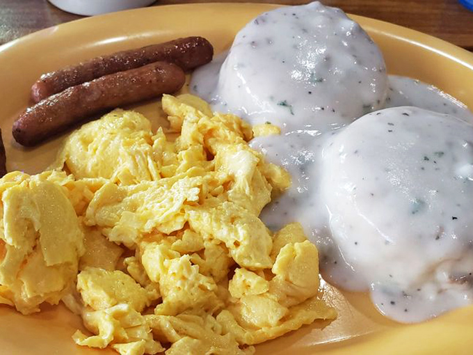Biscuits so fluffy, they might float away if not anchored down by that heavenly gravy. Add eggs and sausage, and you've got a breakfast that could fuel a cattle drive.