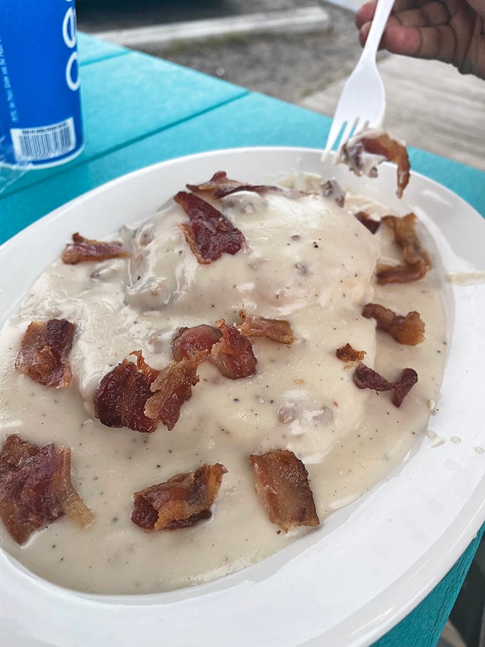 Bacon makes everything better, especially when it's swimming in a sea of creamy gravy. It's like a warm hug for your taste buds.