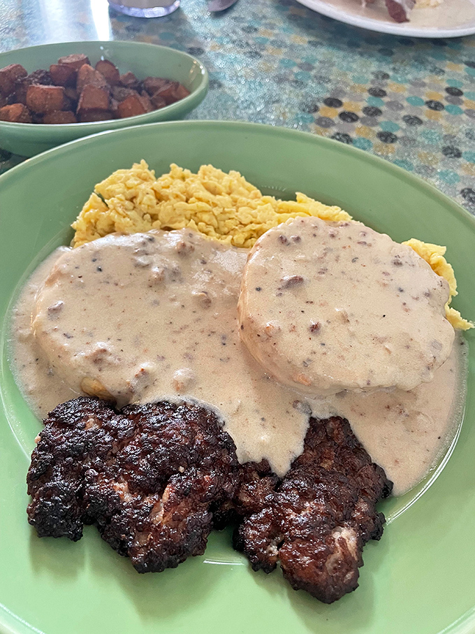 Steak meets its match! These biscuits and gravy are staging a delicious coup d'&eacute;tat on your plate, with scrambled eggs as their loyal soldiers.