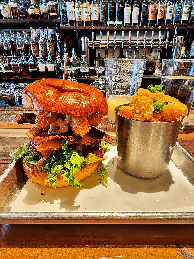 The Bleu Steel Burger struts its stuff alongside golden tots. It's not just a burger, it's a runway-ready flavor explosion!