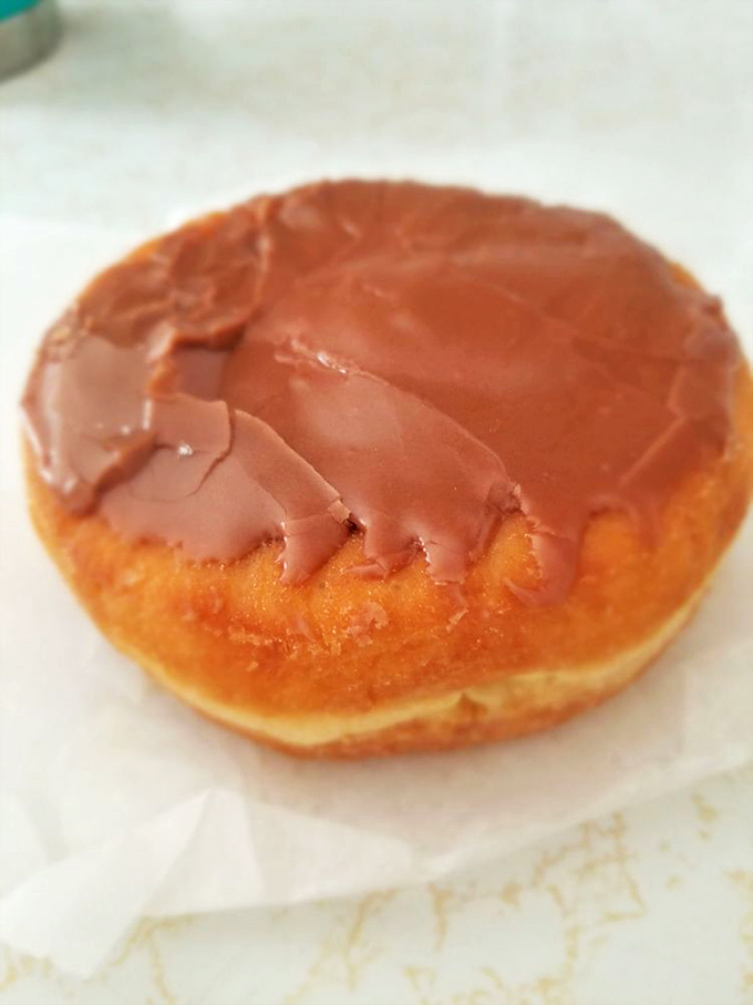 Chocolate lovers, rejoice! This Boston cream donut is ready for its close-up, and trust me, it tastes even better than it looks.