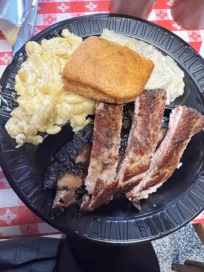 A plate that would make Ron Swanson proud. Brisket, ribs, and sides &ndash; it's not a meal, it's a meat lover's masterpiece.