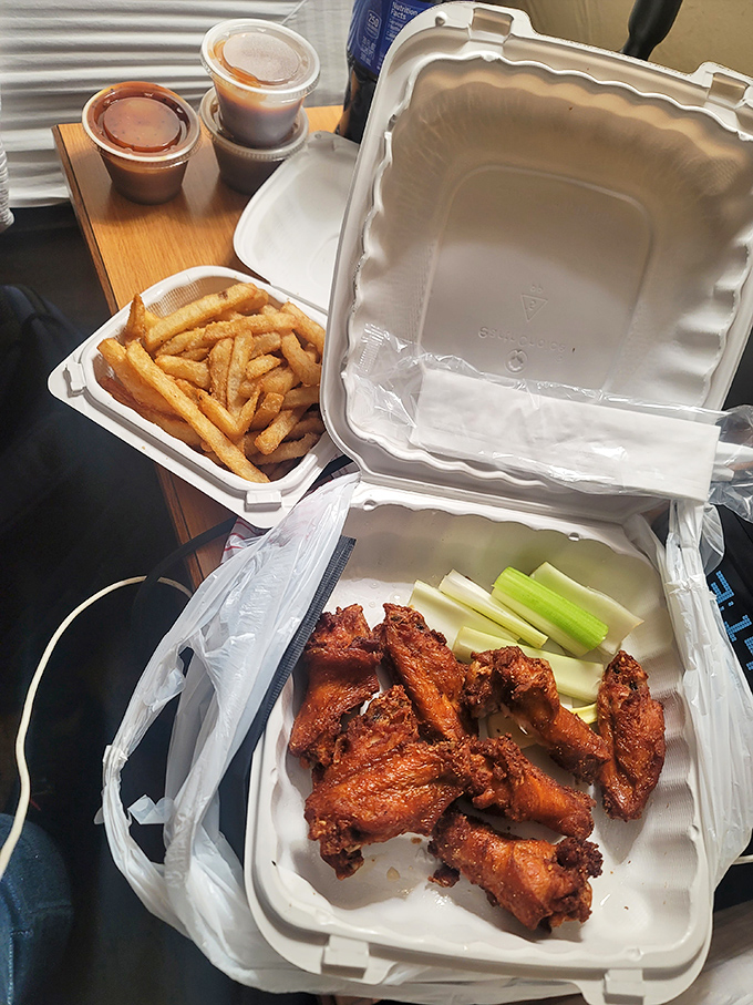 Takeout never looked so tempting. These wings-to-go are like a portable party for your mouth, complete with crispy fries and cool celery sticks for balance.