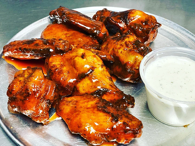 Up close with the stars of the show. These buffalo wings have that perfect sauce-to-crisp ratio that makes napkins necessary but completely worth it.