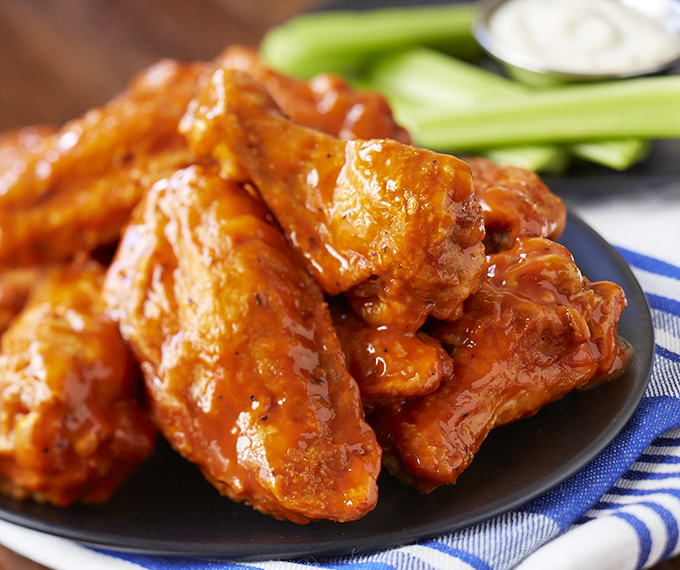 These wings aren't just hot, they're smokin'! Glossy, saucy, and ready to set your taste buds ablaze.
