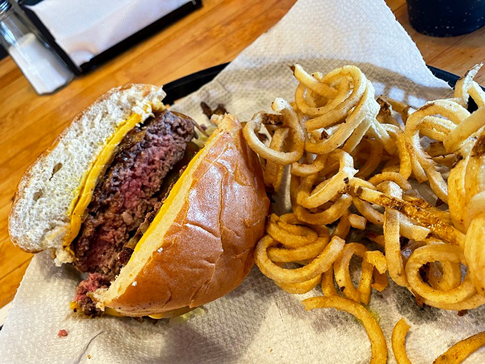 The dynamic duo of diner dreams. This burger and fries combo is like Batman and Robin, if they were delicious and didn't fight crime.