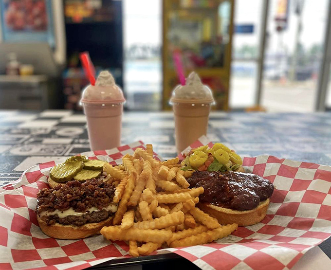 The holy trinity of comfort food: A juicy burger, crispy fries, and a creamy shake. It's like a hug for your taste buds.