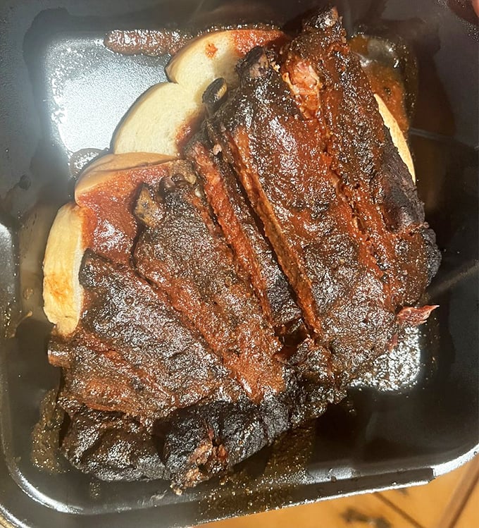 These ribs have gotten so cozy with the smoker, they're practically family now. Just look at that perfect char!