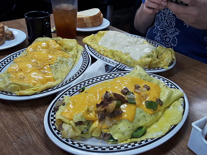 Three's company when it comes to these cheesy omelets. It's like a Jackson Pollock painting, if he worked exclusively in shades of yellow.