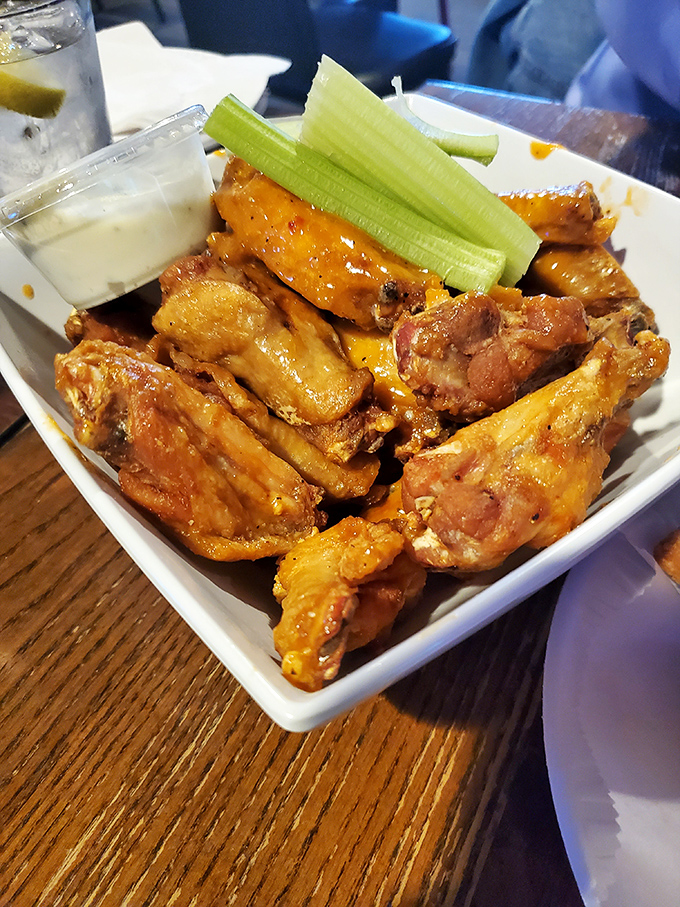 The classic presentation&mdash;wings, celery, and bleu cheese&mdash;proves some traditions exist for a reason. This is comfort food elevated to an art form.