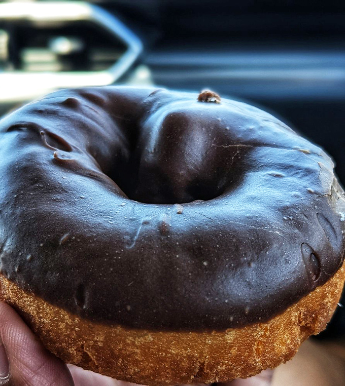 Chocolate lovers, rejoice! This glossy masterpiece is the little black dress of the donut world - timeless and irresistible.