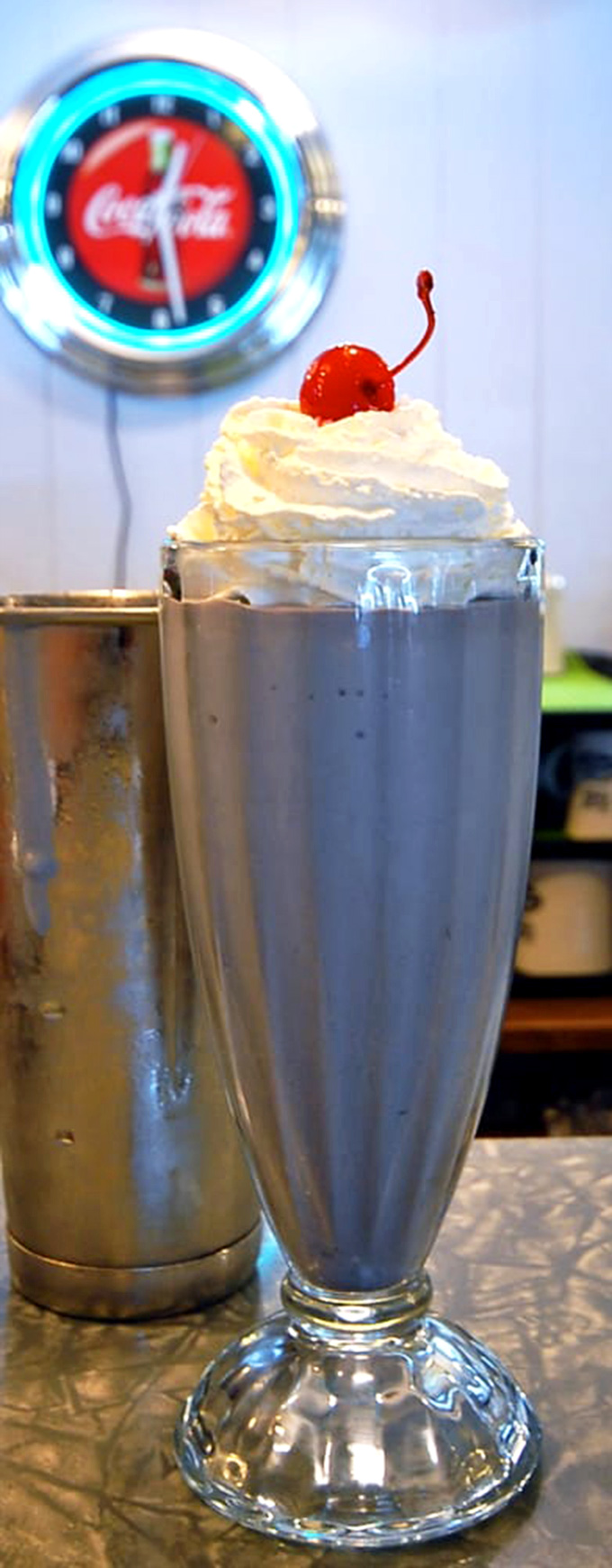 Chocolate lovers, rejoice! This milkshake is the stuff of Willy Wonka's dreams, topped with a cloud of whipped cream and a cherry on top.