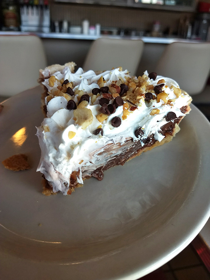 Chocolate and peanut butter, a match made in dessert heaven. This pie is like a Reese's cup had a dream, and it came true.