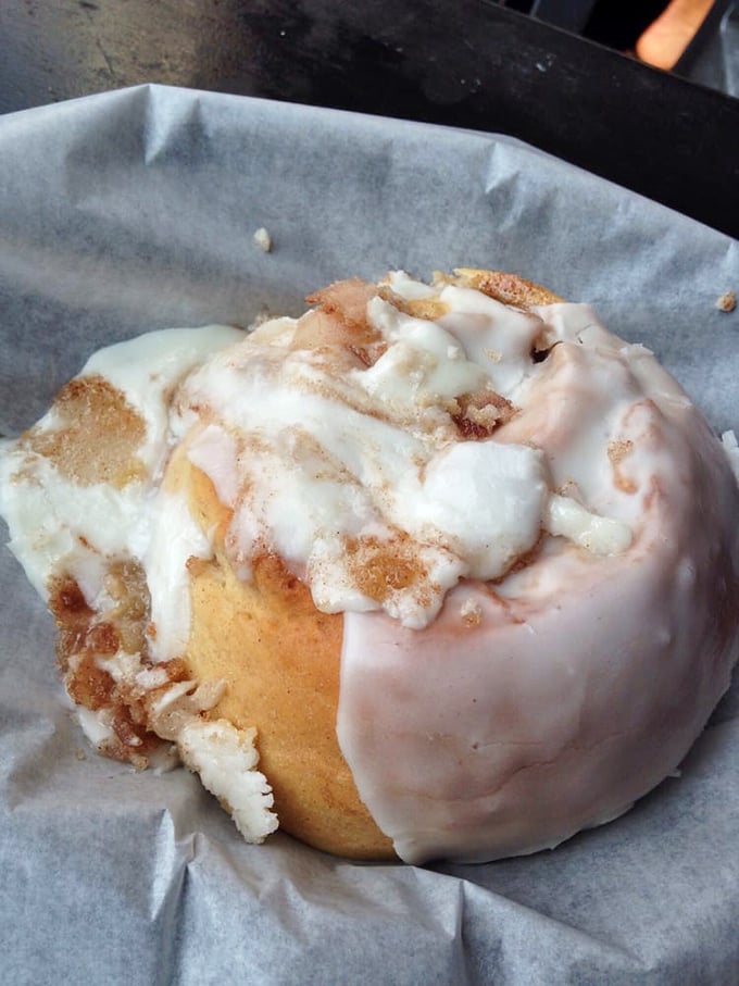Behold, the Rolls Royce of cinnamon rolls! This close-up reveals layers of buttery perfection, crowned with a cascade of heavenly frosting.
