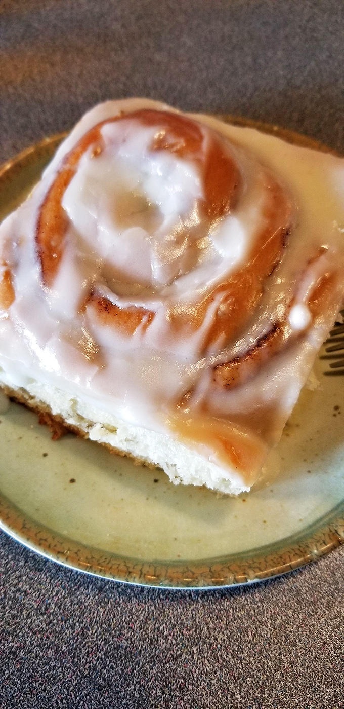 This isn't just a cinnamon roll; it's an edible work of art that makes you wonder if you've been wasting your life eating inferior pastries.