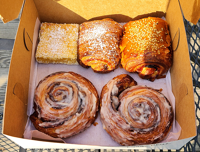 It's a carb lover's dream team! Cinnamon rolls, croissants, and a lemon bar walk into a bakery... and straight into our hearts (and stomachs).