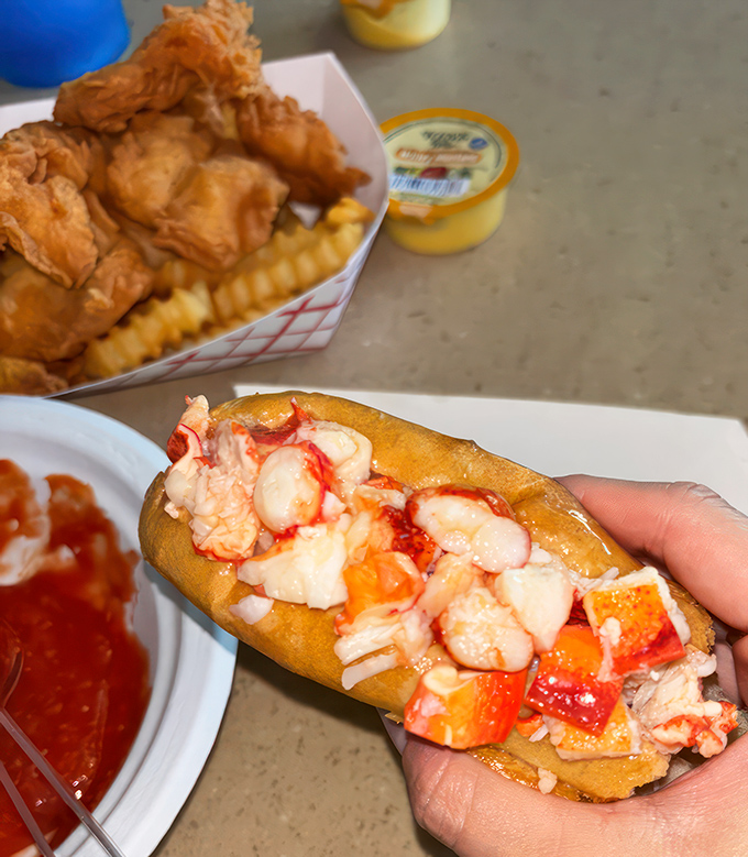 Lobster roll perfection! Chunks of sweet Maine lobster nestled in a buttery roll &ndash; it's like the ocean and a bakery had a delicious love child.