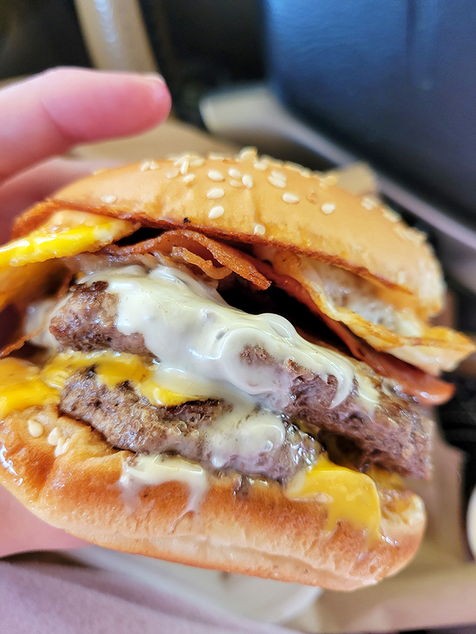 Double the patty, double the pleasure! This burger is stacked higher than your grandpa's stories about walking to school uphill both ways.
