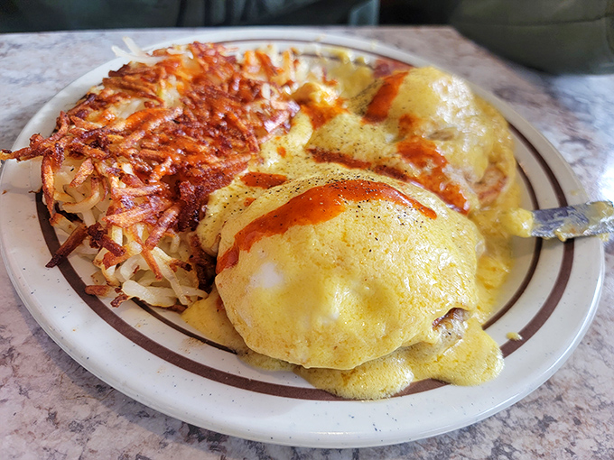 Benedict Arnold may have been a traitor, but these eggs Benedict are loyal to flavor. Hollandaise sauce cascades like a buttery waterfall over poached perfection.