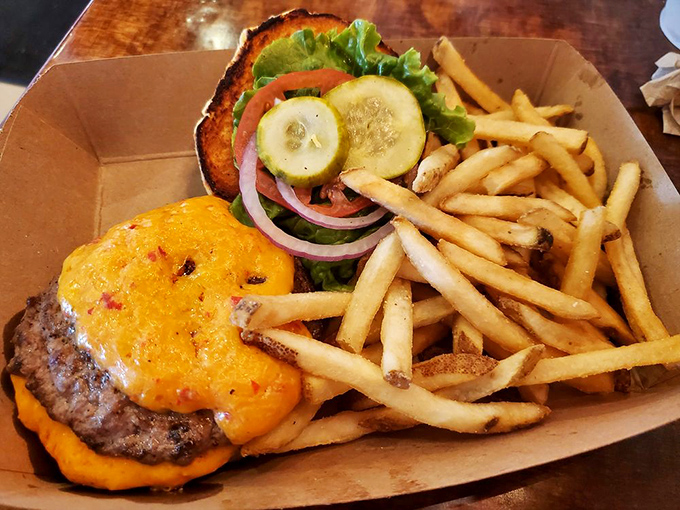 The El Magooey: Where burger meets art. It's like Jackson Pollock painted with condiments, and we're here for it.