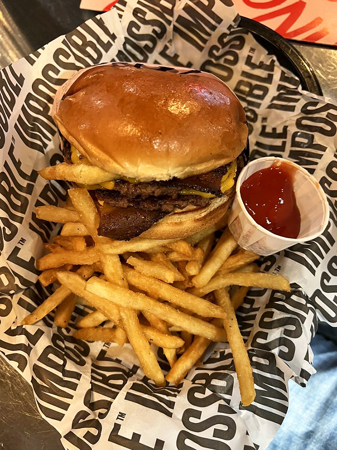 Holy moly, would you look at that? The Francis Burger with bacon is a towering testament to the art of burger-making, glistening with cheesy, meaty perfection.