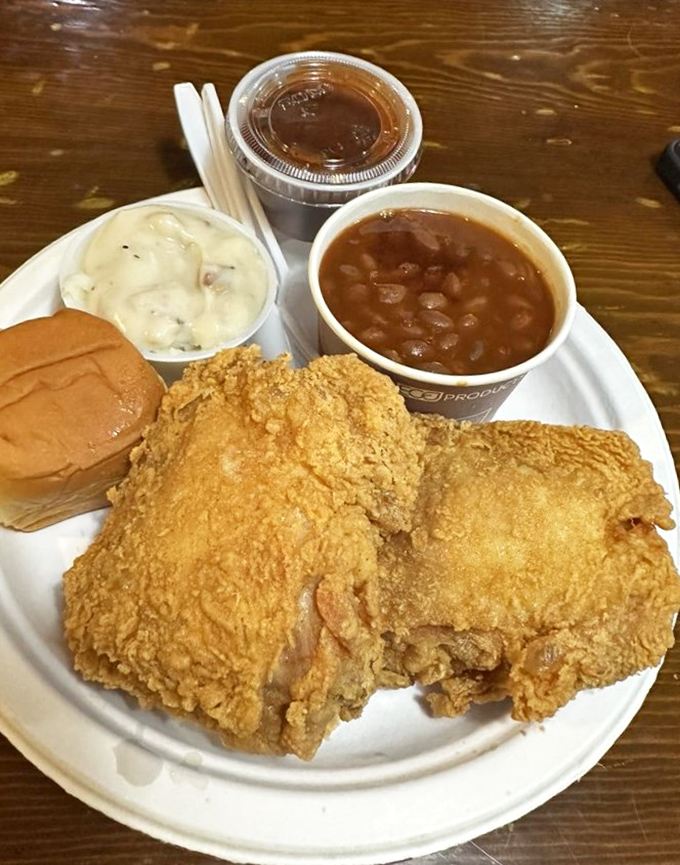 Southern comfort on a plate! This golden-fried chicken with all the fixings is like a warm hug from your favorite aunt &ndash; if your aunt was a culinary genius.