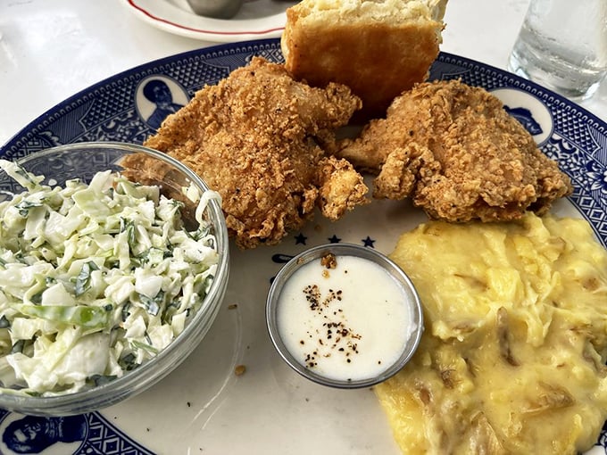 Fried chicken so perfectly golden, it deserves its own trophy, while those mashed potatoes quietly steal the show.