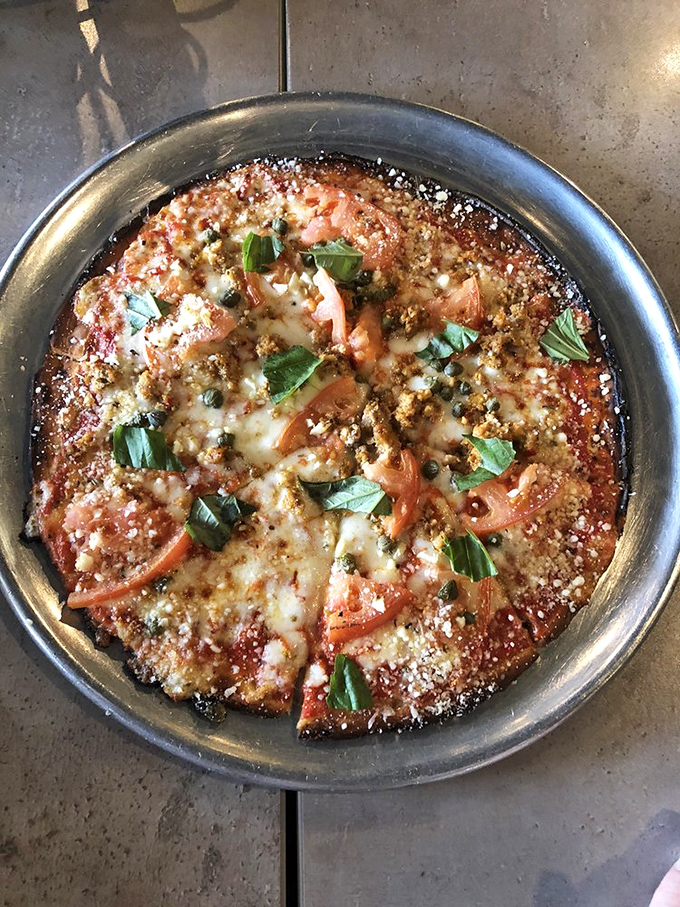 The Garden District Pizza: A slice of veggie heaven that would make even the most devoted carnivore consider switching teams. At least for one meal.